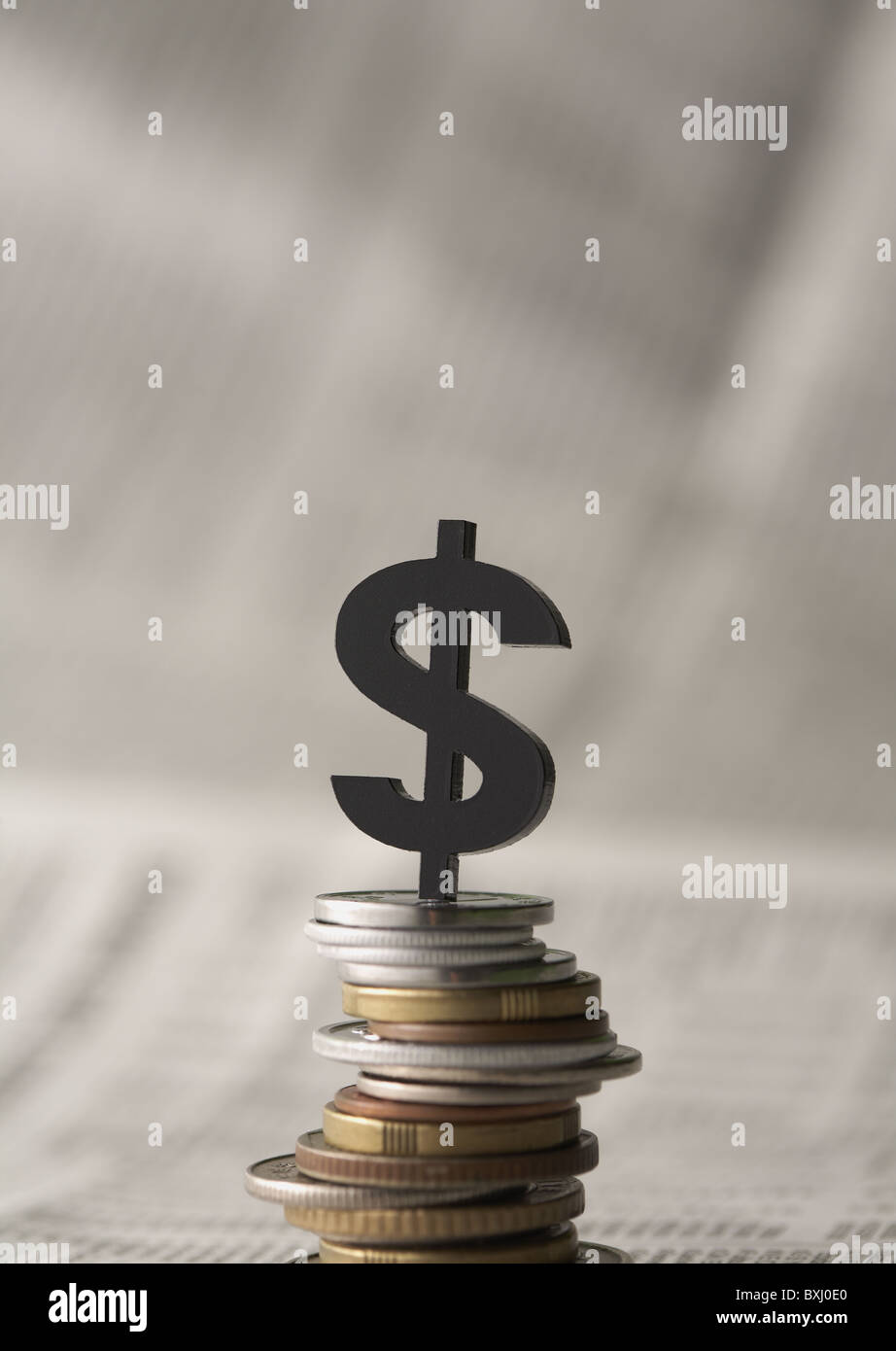 Dollar sign and coins Stock Photo - Alamy