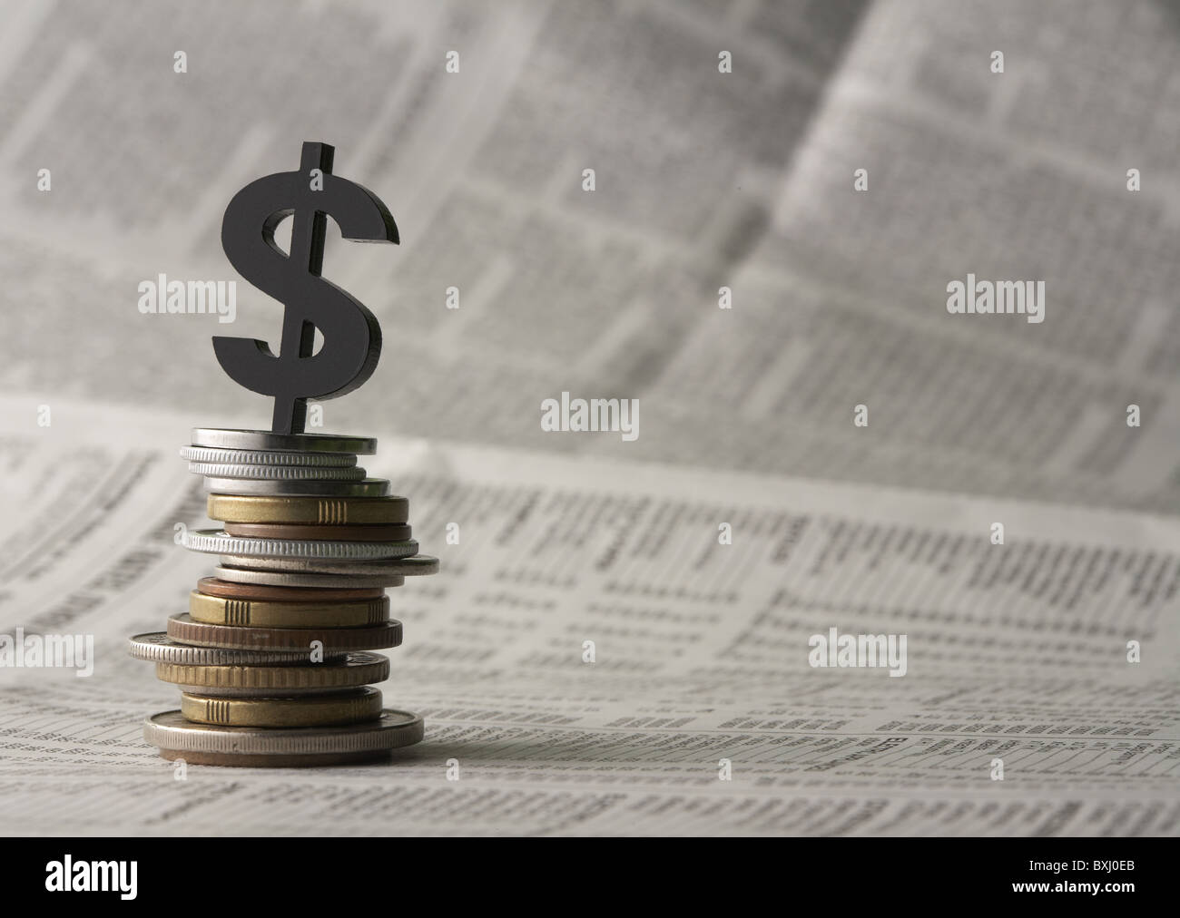 Dollar sign and coins Stock Photo - Alamy