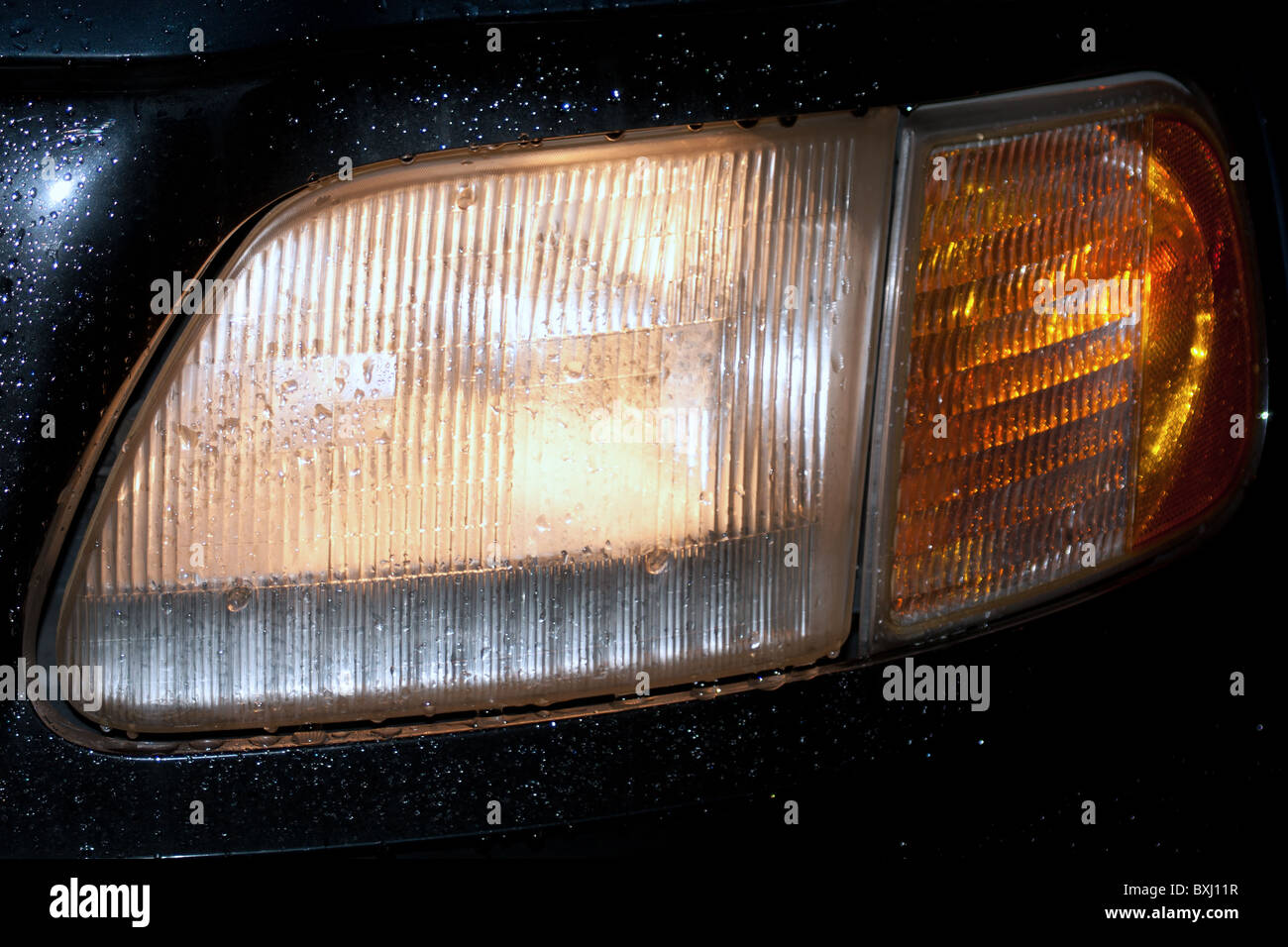 rain water night headlight car light vehicle front Stock Photo - Alamy