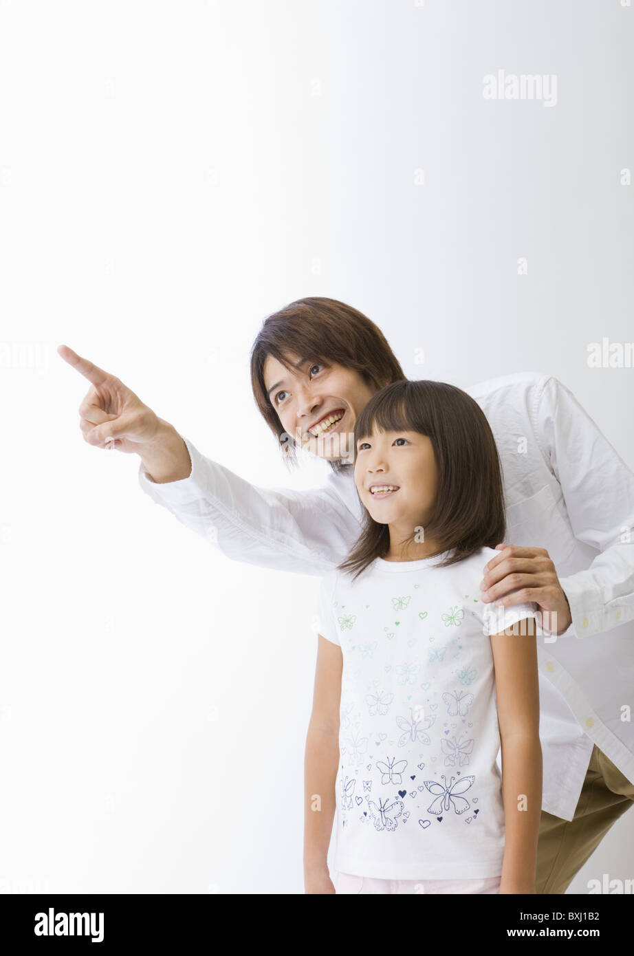 Father pointing and his daughter looking at it Stock Photo - Alamy