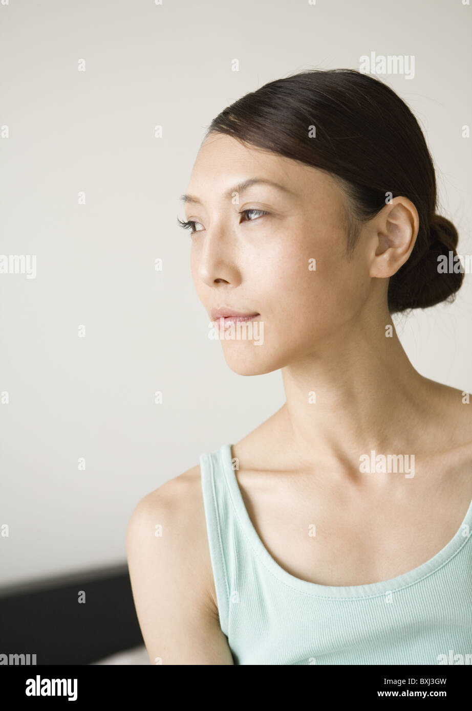 A woman turning sideways Stock Photo - Alamy