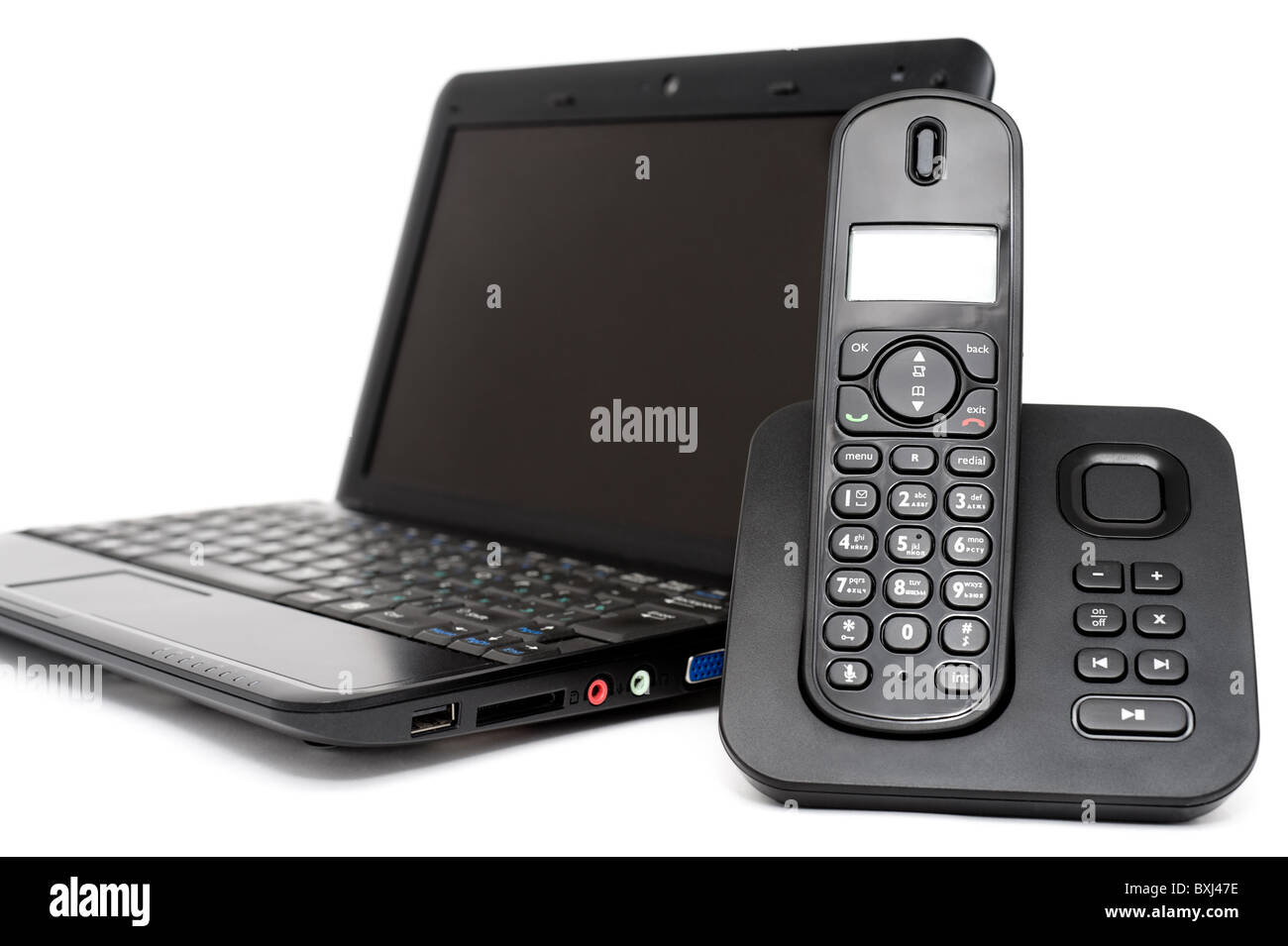 black netbook and decked telephone over white background Stock Photo ...