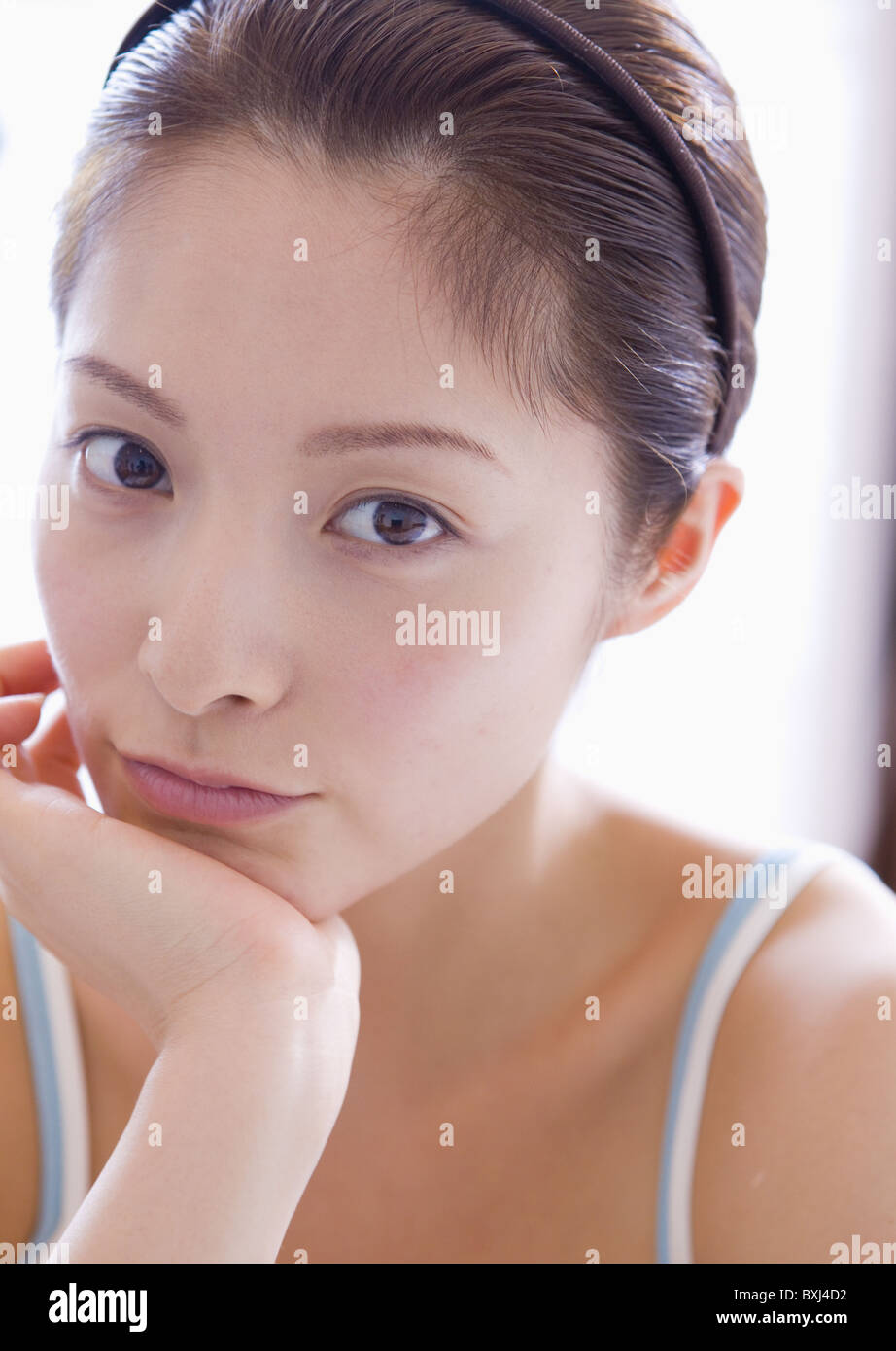 Putting hand on her chin hi-res stock photography and images - Alamy