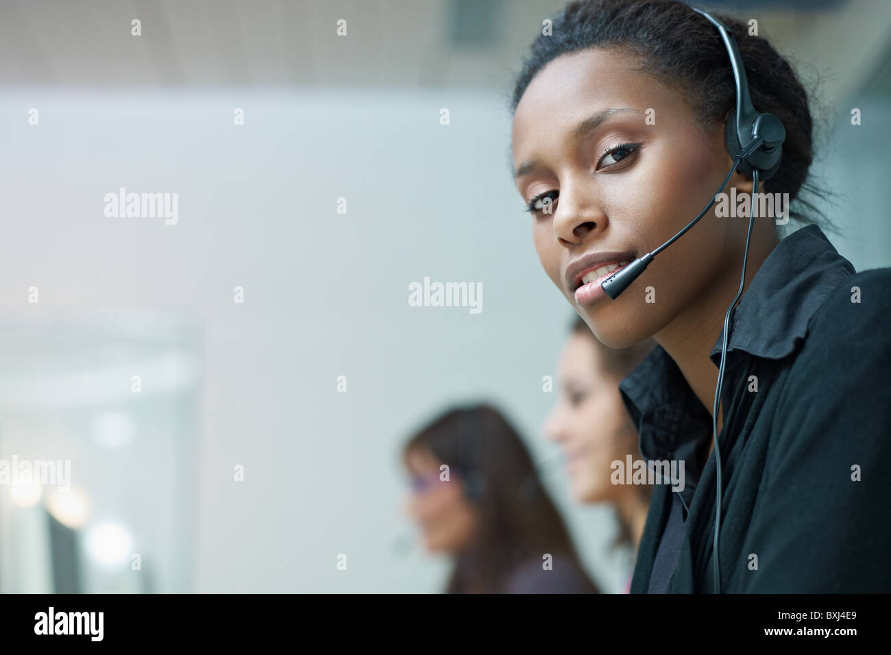 multiethnic group of female customer service representatives talking on ...