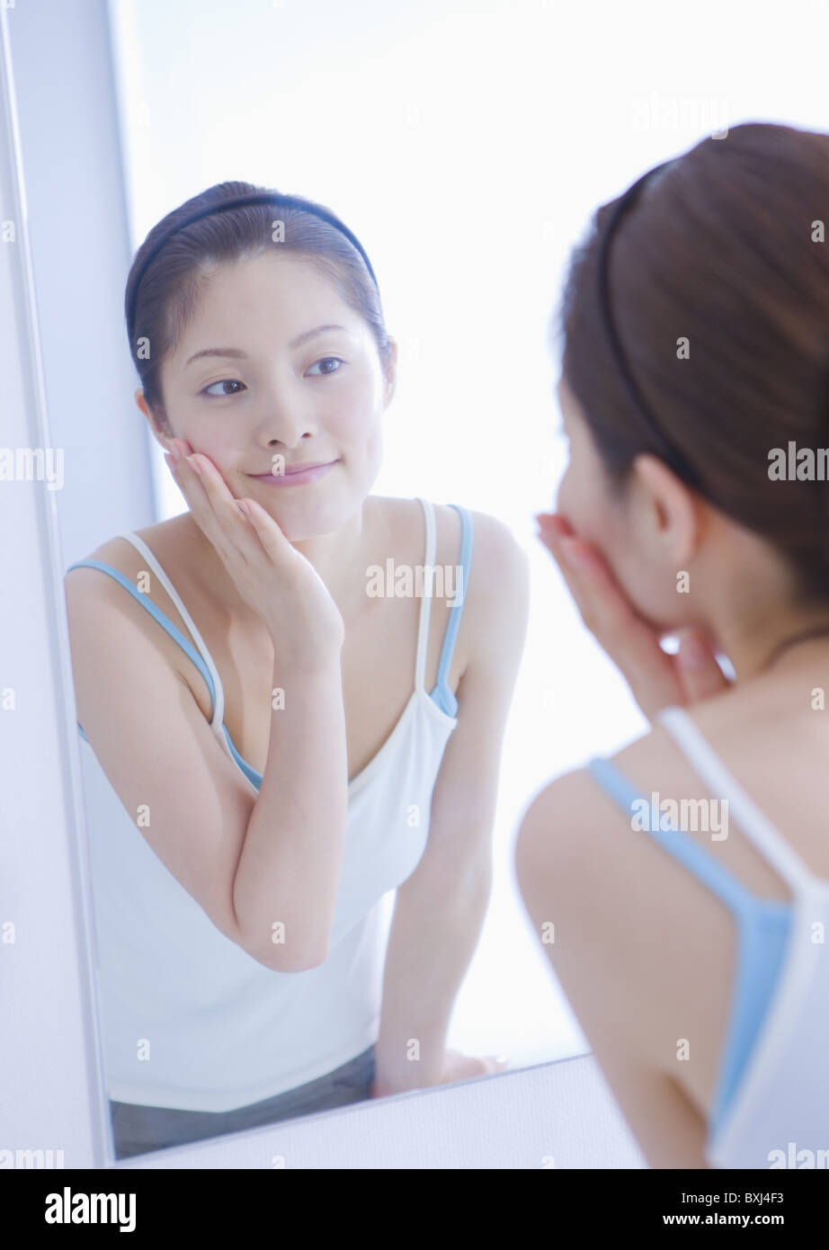 Woman taking care of her face Stock Photo - Alamy