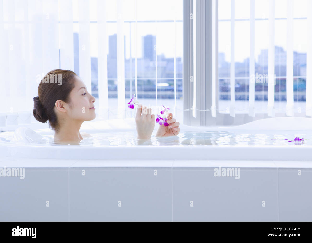 Woman taking a bath Stock Photo - Alamy
