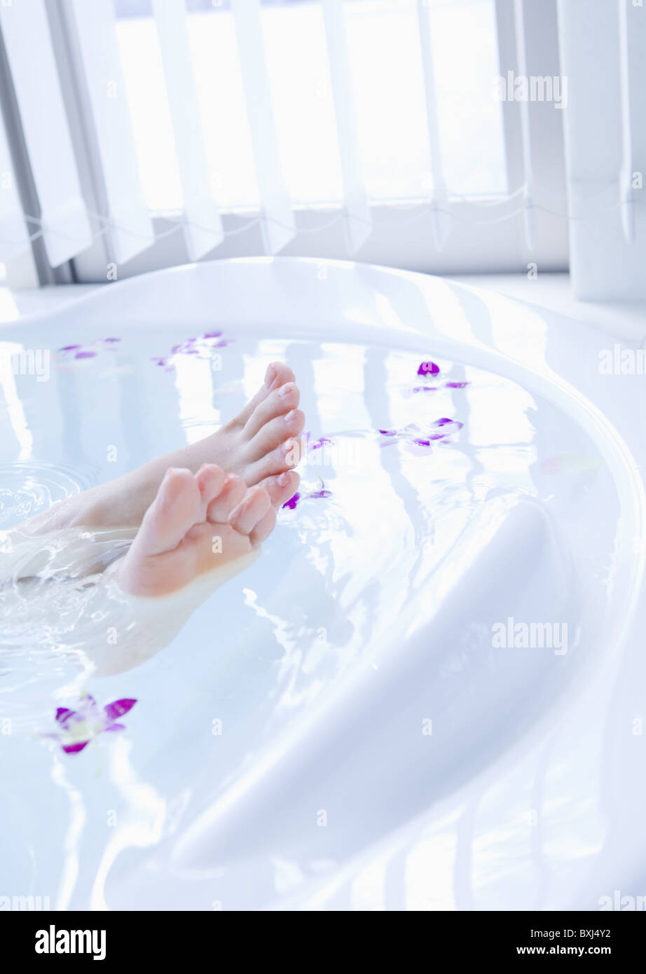 Woman's leg taking a bath, closeup Stock Photo - Alamy