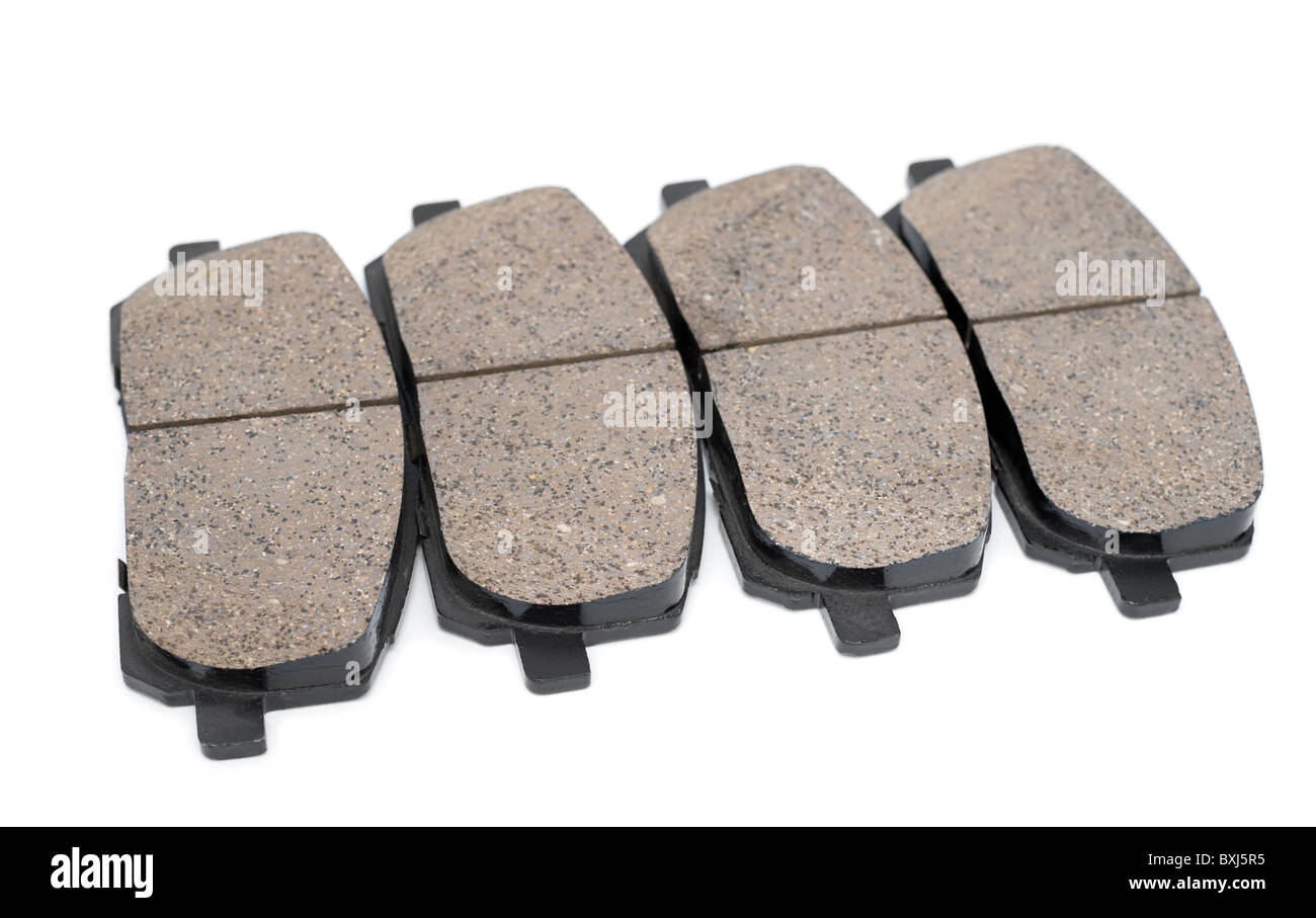 a full set of brake pads over white background Stock Photo - Alamy