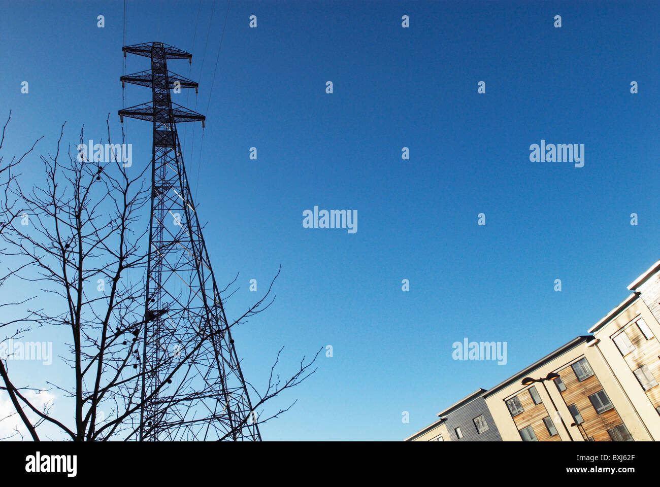 Electric pylon towering over new housing development Colchester UK ...