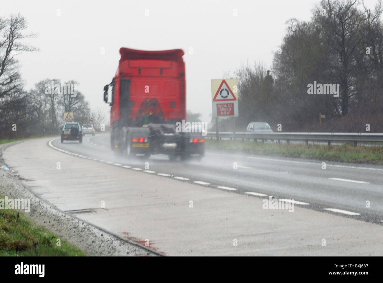 Wet weather driving conditions on dual carriageway Suffolk UK Stock Photo - Alamy