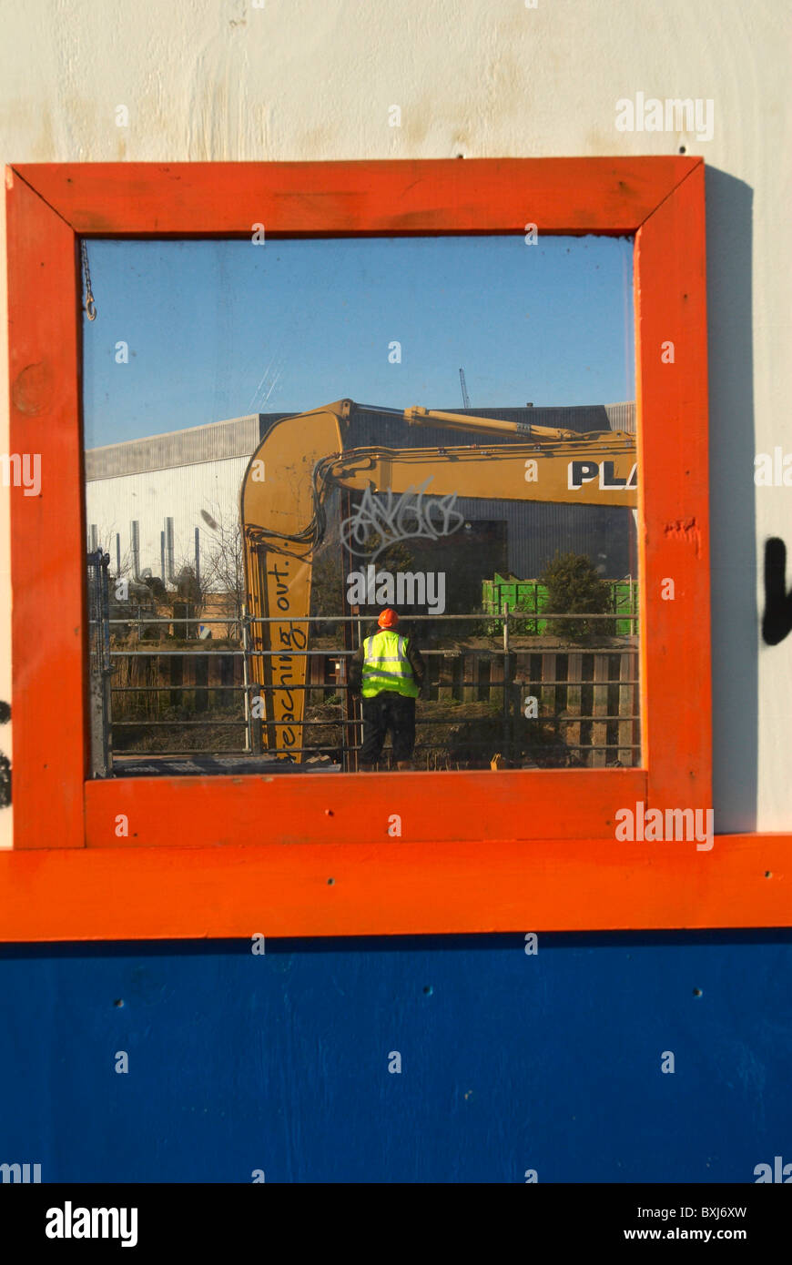 Looking through window on hoarding Bow London UK Stock Photo - Alamy