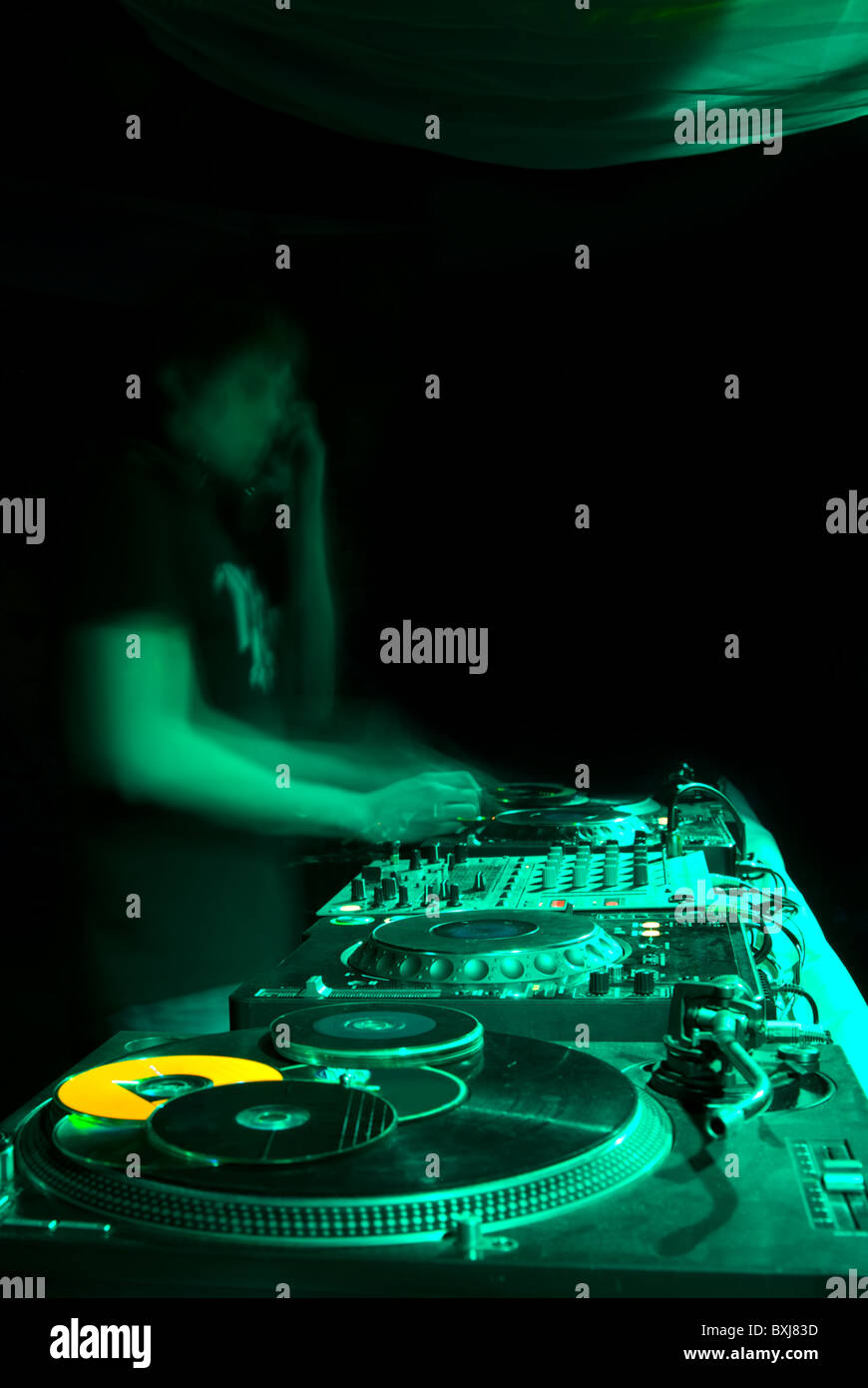 blurred dj at spin table in night club Stock Photo - Alamy