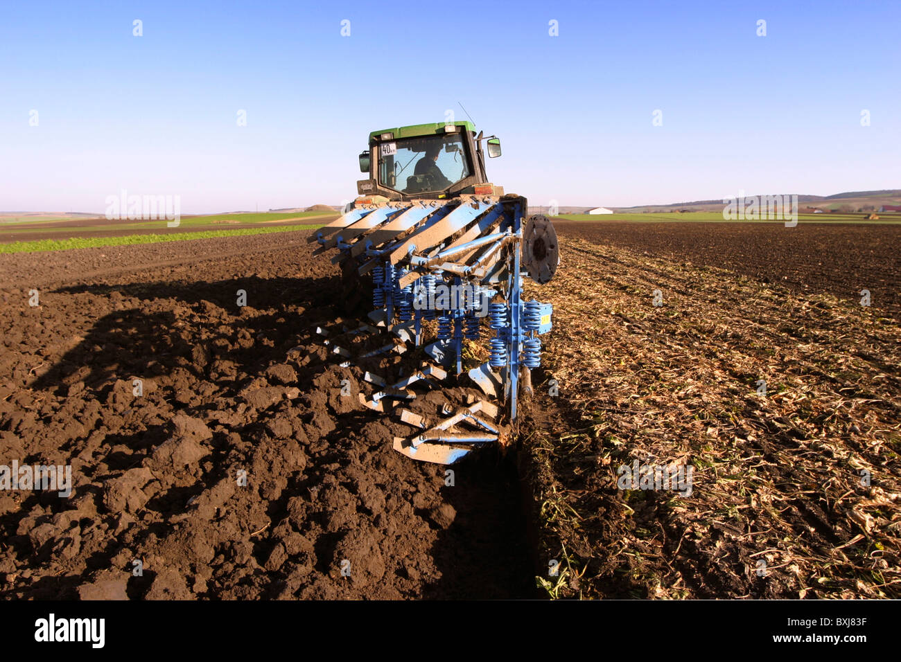 Tractor with plow Stock Photo - Alamy
