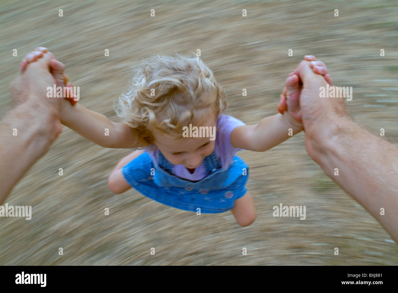 Father spinning daughter around hi-res stock photography and images - Alamy