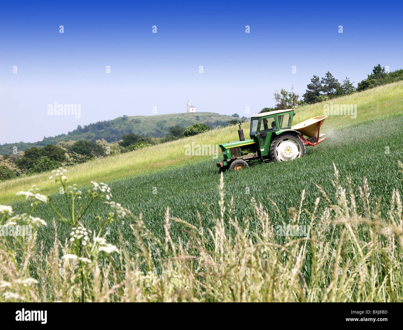 Farmer working in the fields Stock Photo - Alamy