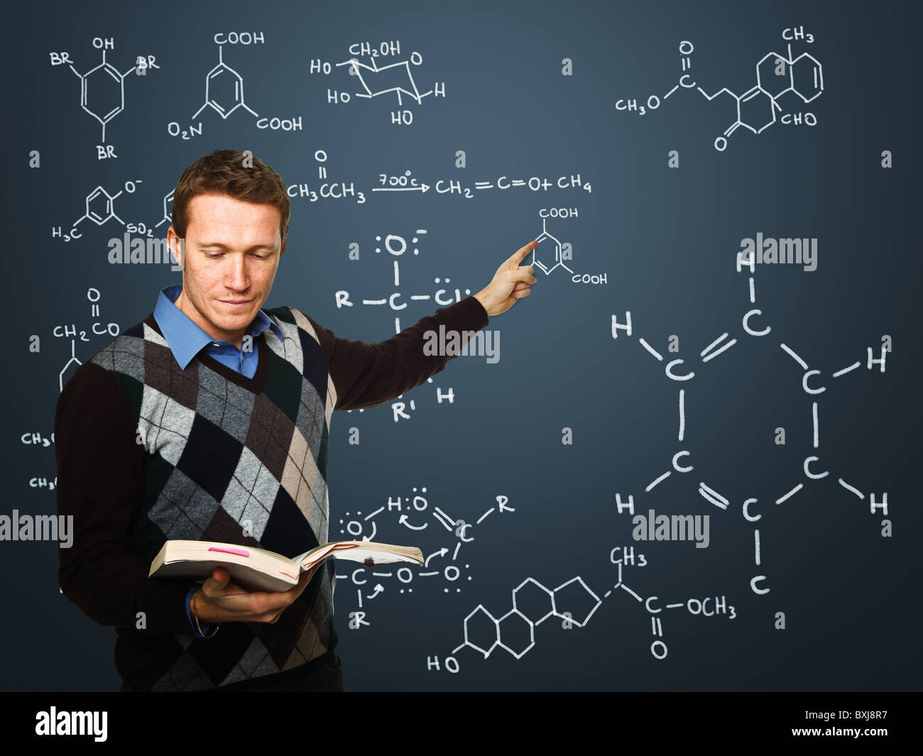 young teacher at work with classic blackboard background Stock Photo ...