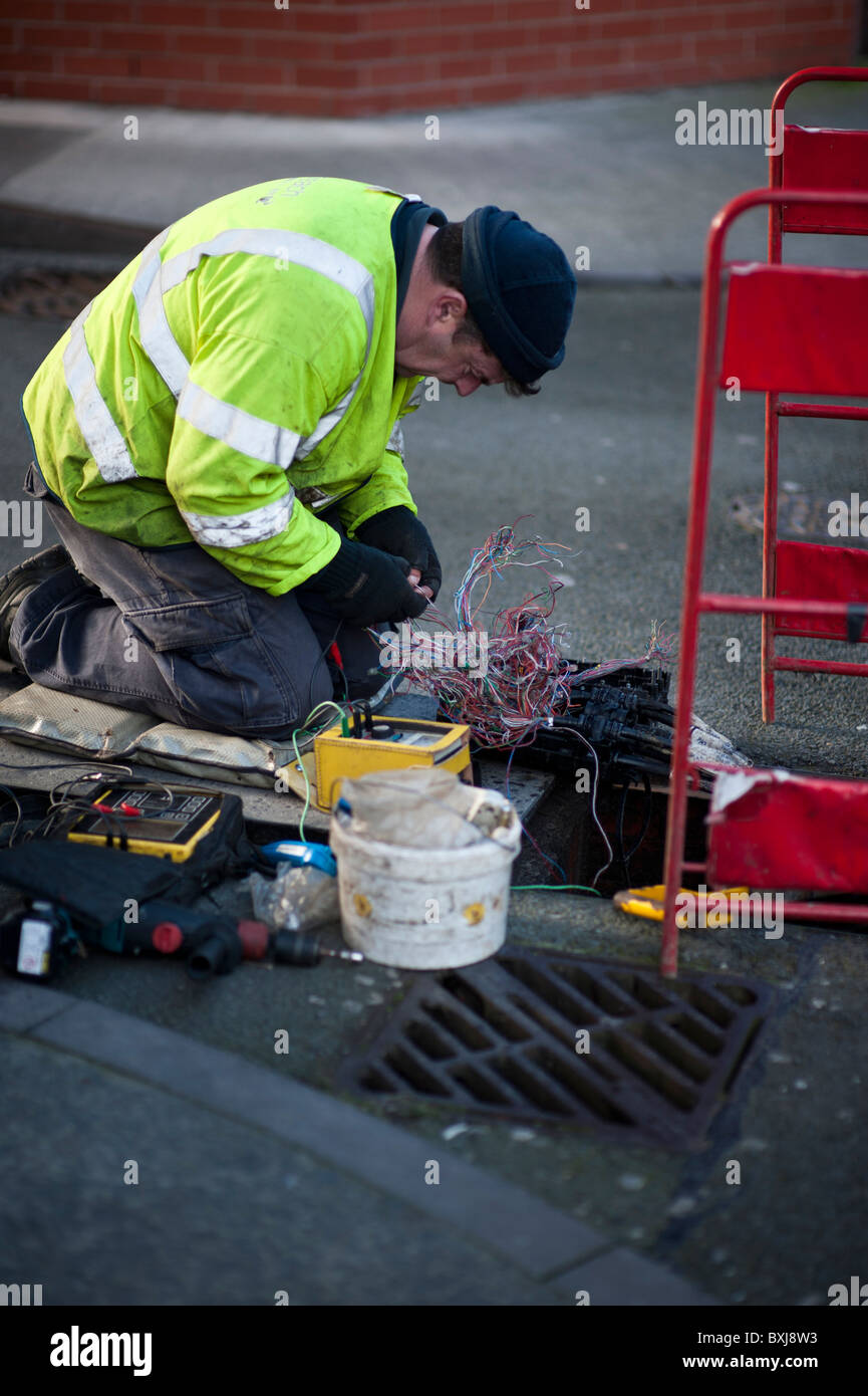 A BT British Telecom phone engineer examining telephone lines, UK Stock ...