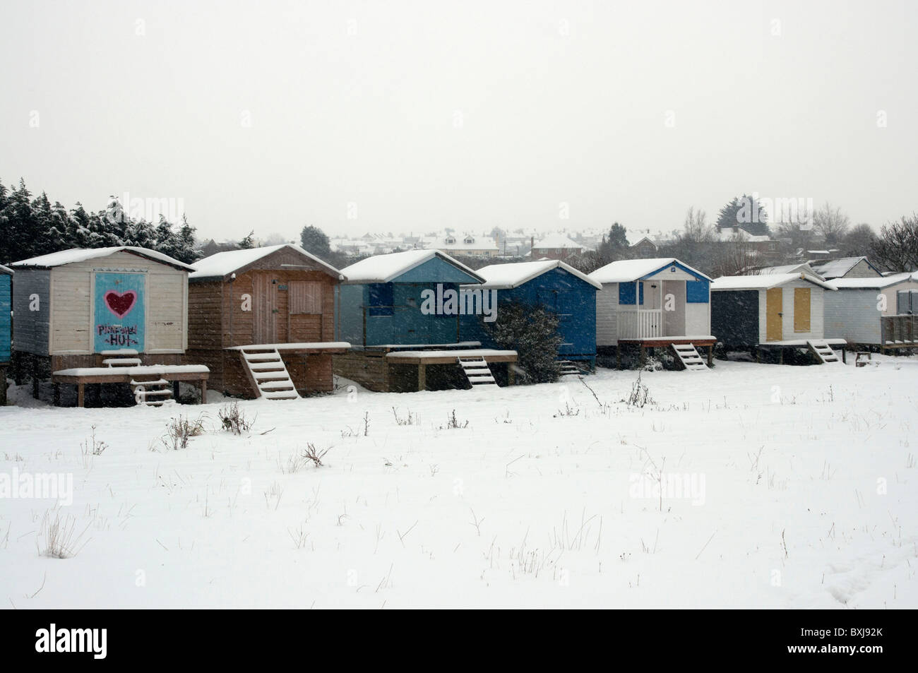 Snow falling Whitstable Kent beach huts covered in snow Stock Photo - Alamy