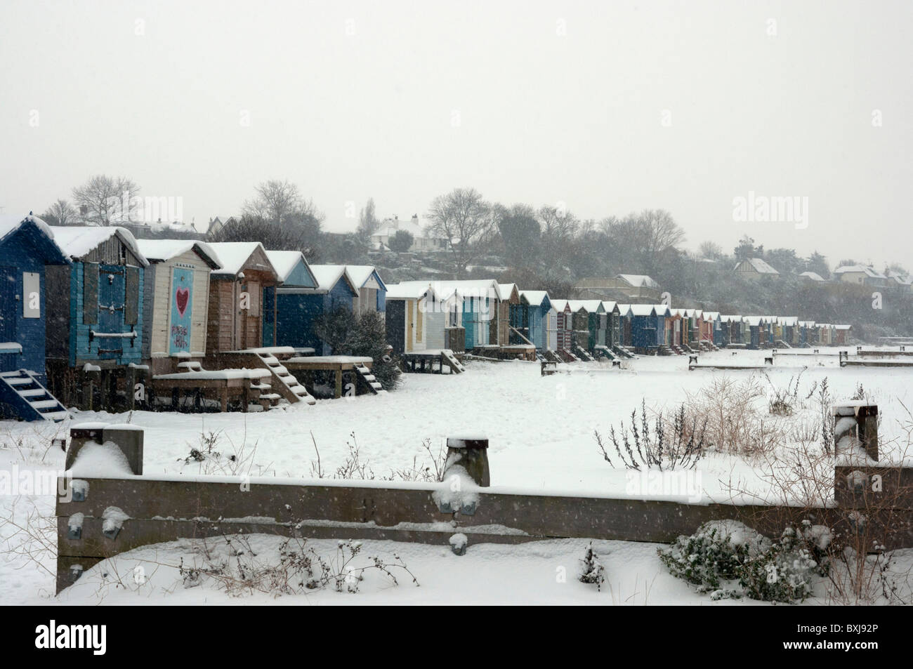 Snow falling Whitstable Kent beach huts covered in snow Stock Photo - Alamy
