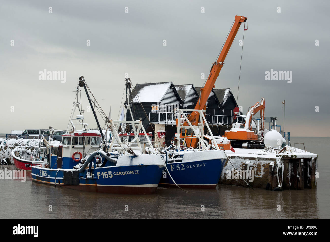 Whitstable harbour begins to freeze fishing boats whitstable Kent UK ...