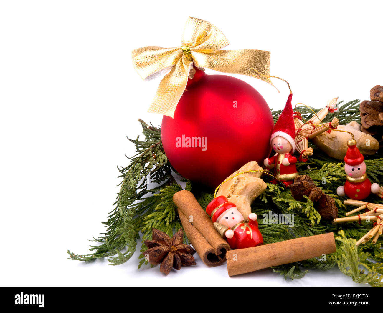 Closeup picture of thuja branches, red glass ball, spices and small ...