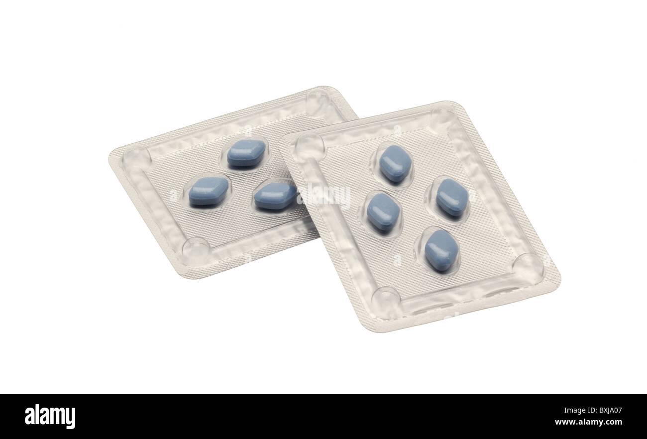 Two blister packs of blue Viagra anti-impotence tablets isolated on a ...