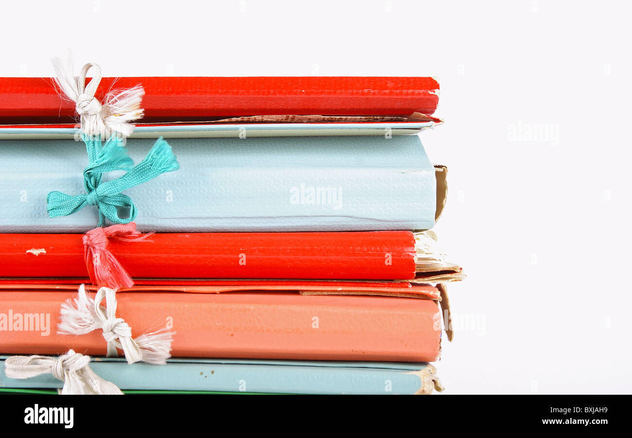 Pile of cardboard folders with ribbon bows Stock Photo - Alamy