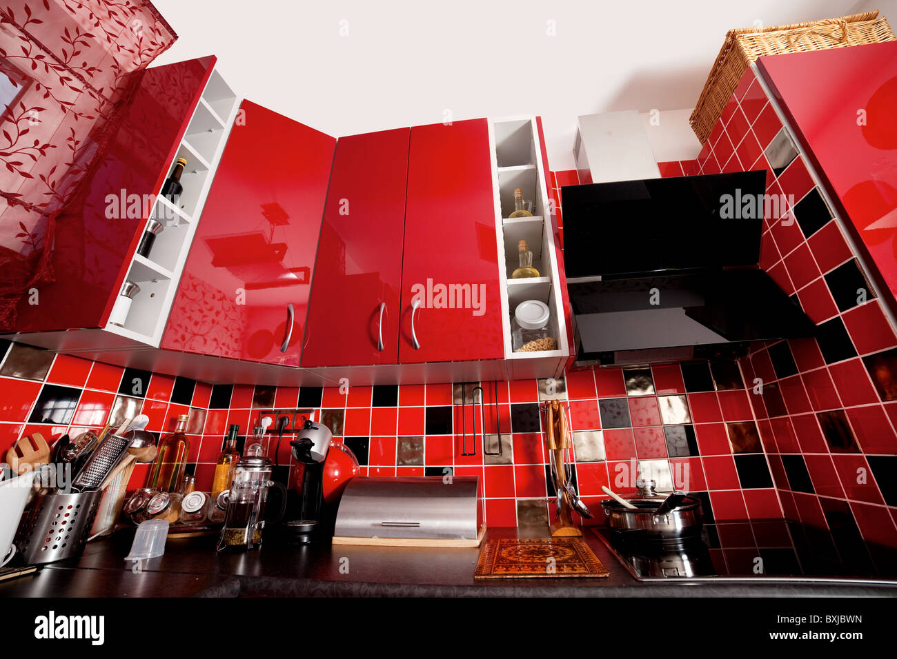 Close up shoot of a red modern kitchen including kitchenware Stock ...