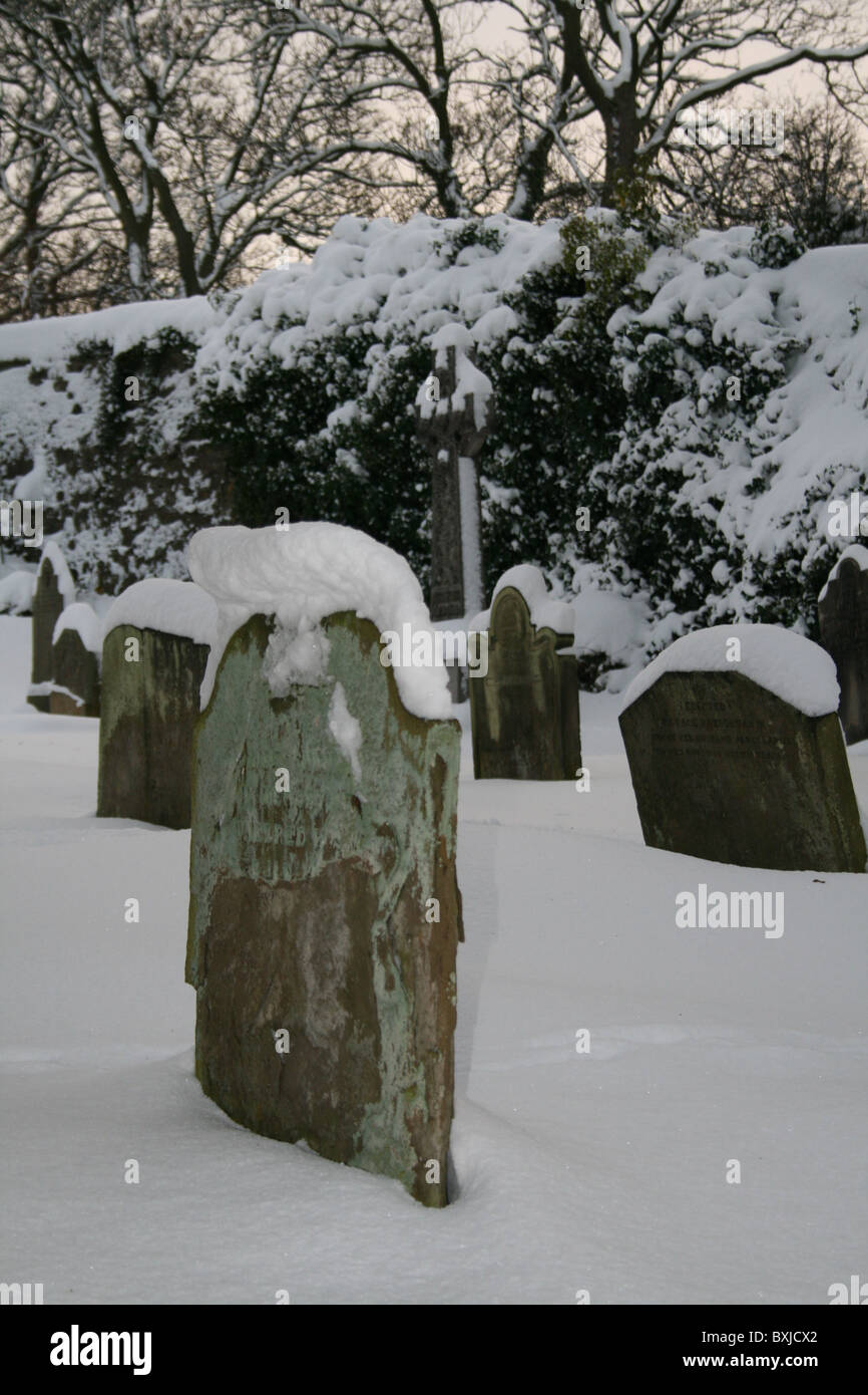Winter church and snow covered grave yard Stock Photo - Alamy