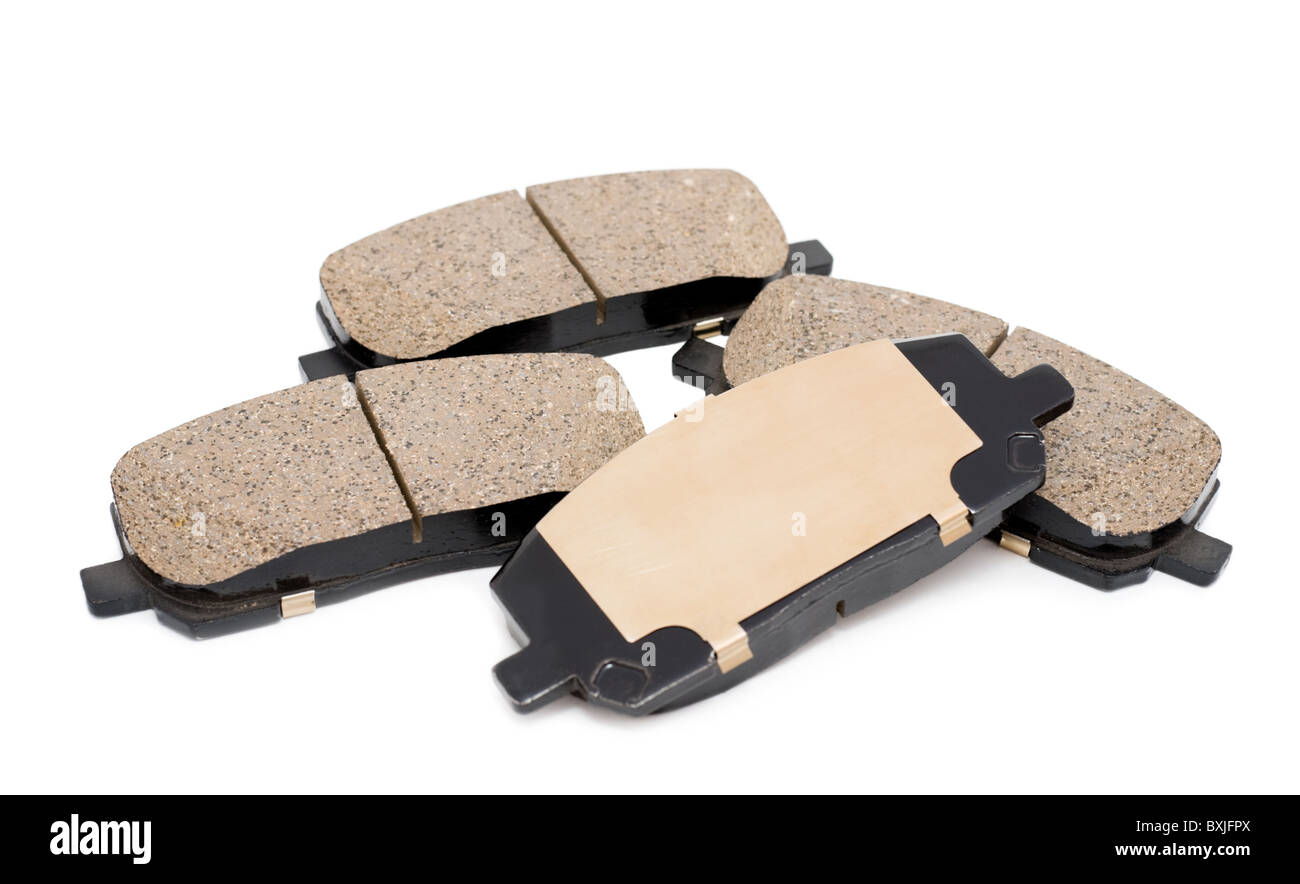 a full set of brake pads over white background Stock Photo - Alamy
