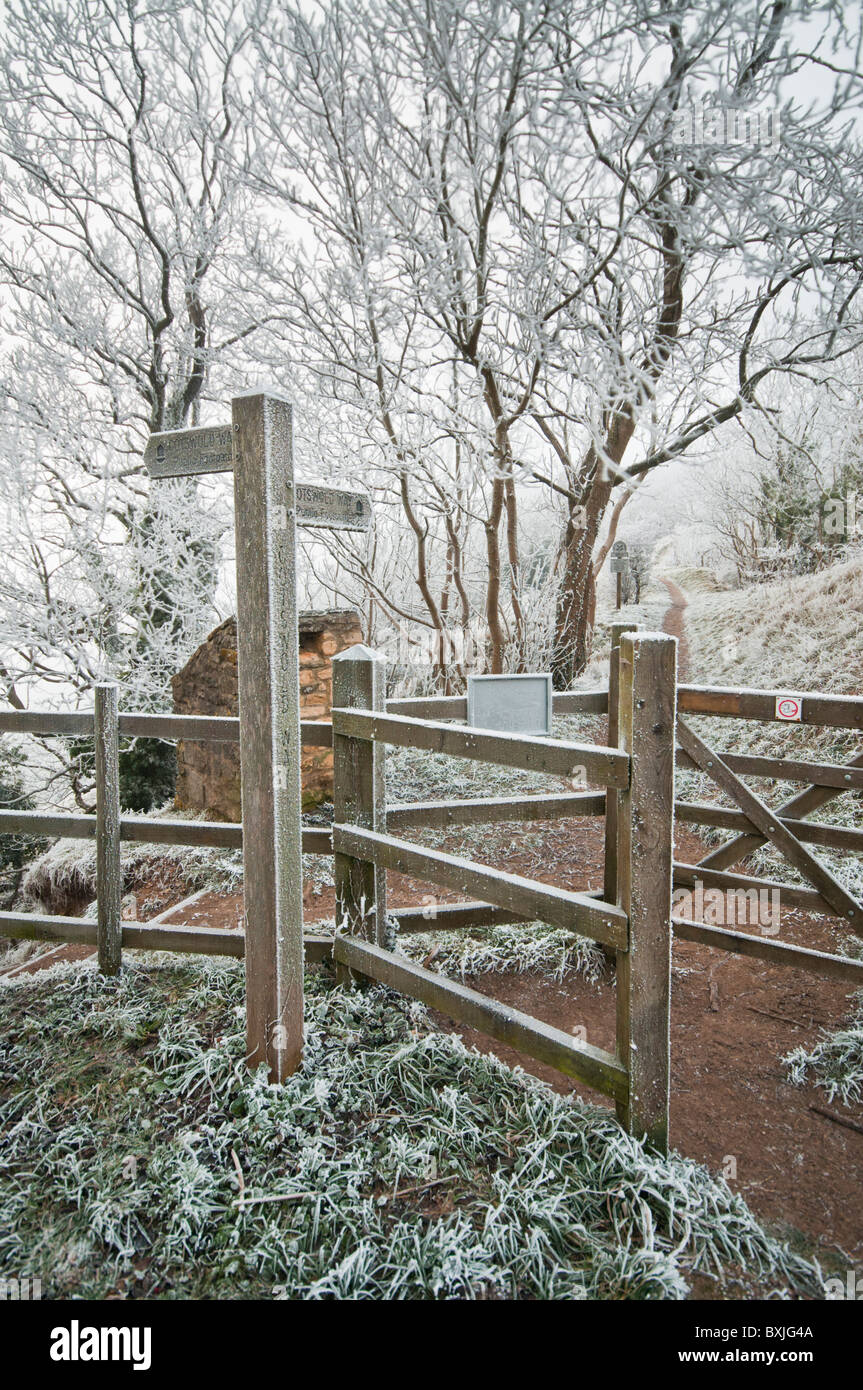 Frost covered kissing gate with Cotswold Way sign, Haresfield Beacon ...