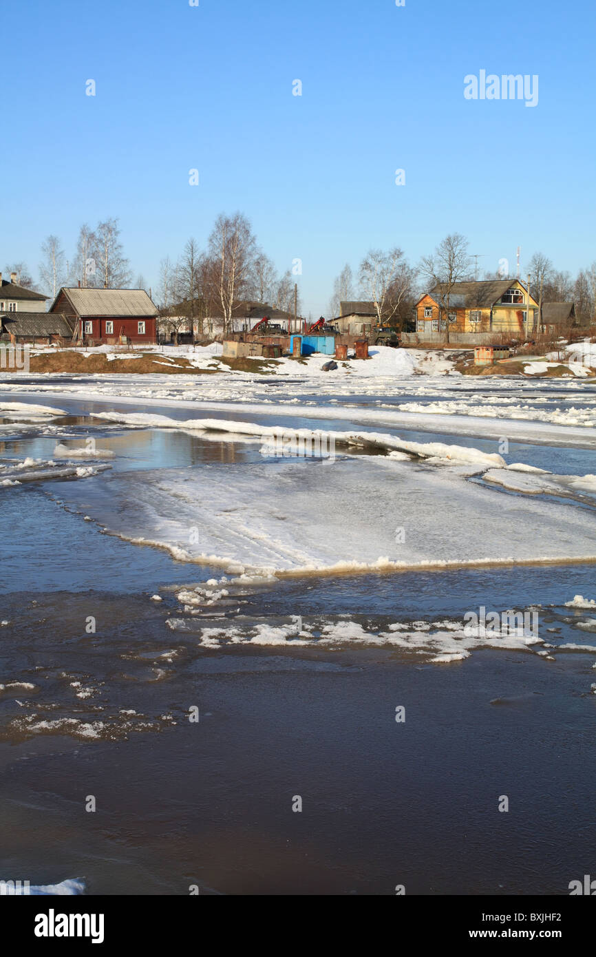 driving of ice on river near villages Stock Photo - Alamy