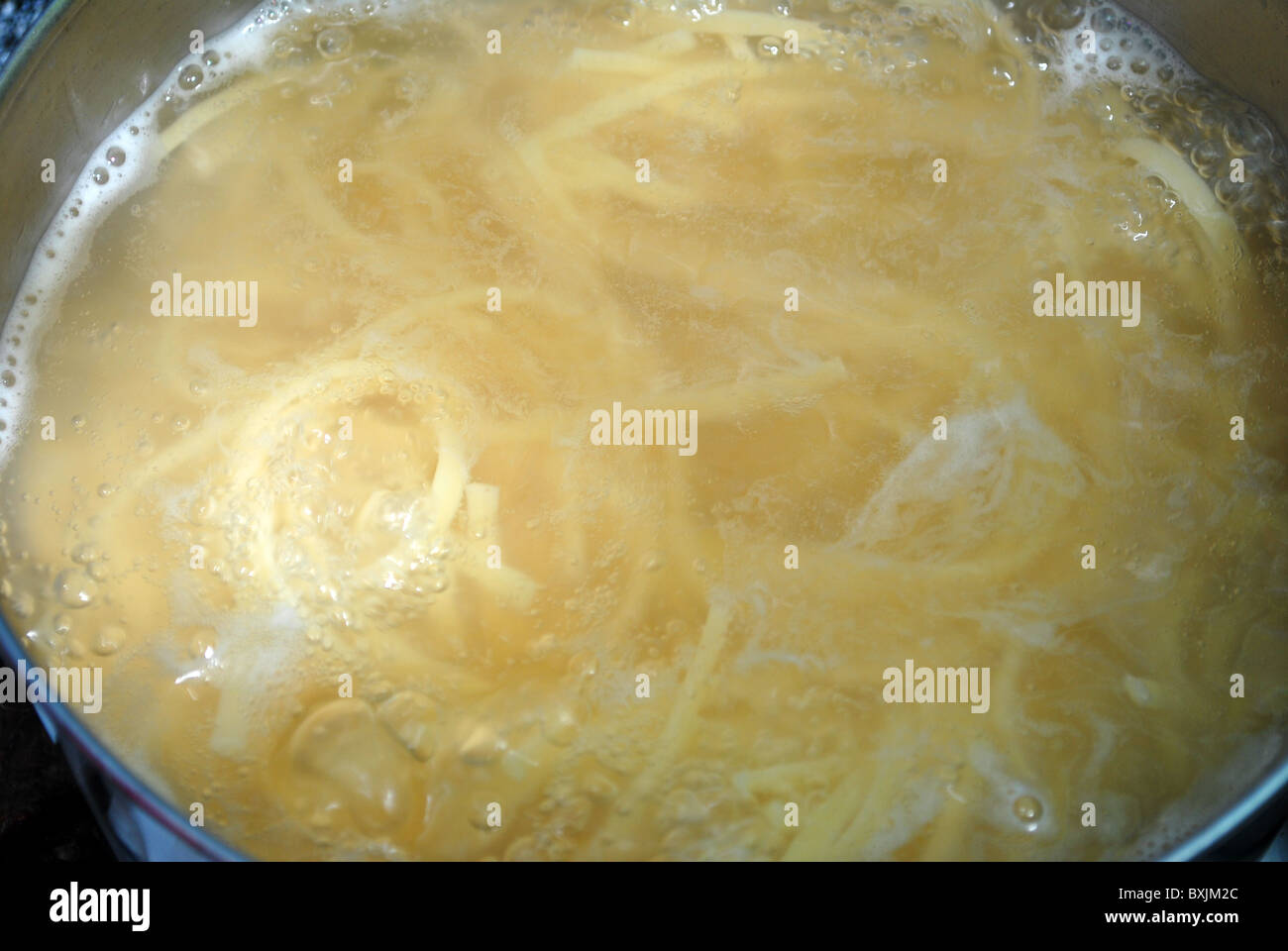pasta cooking in boiling water typical Italian meal Stock Photo - Alamy
