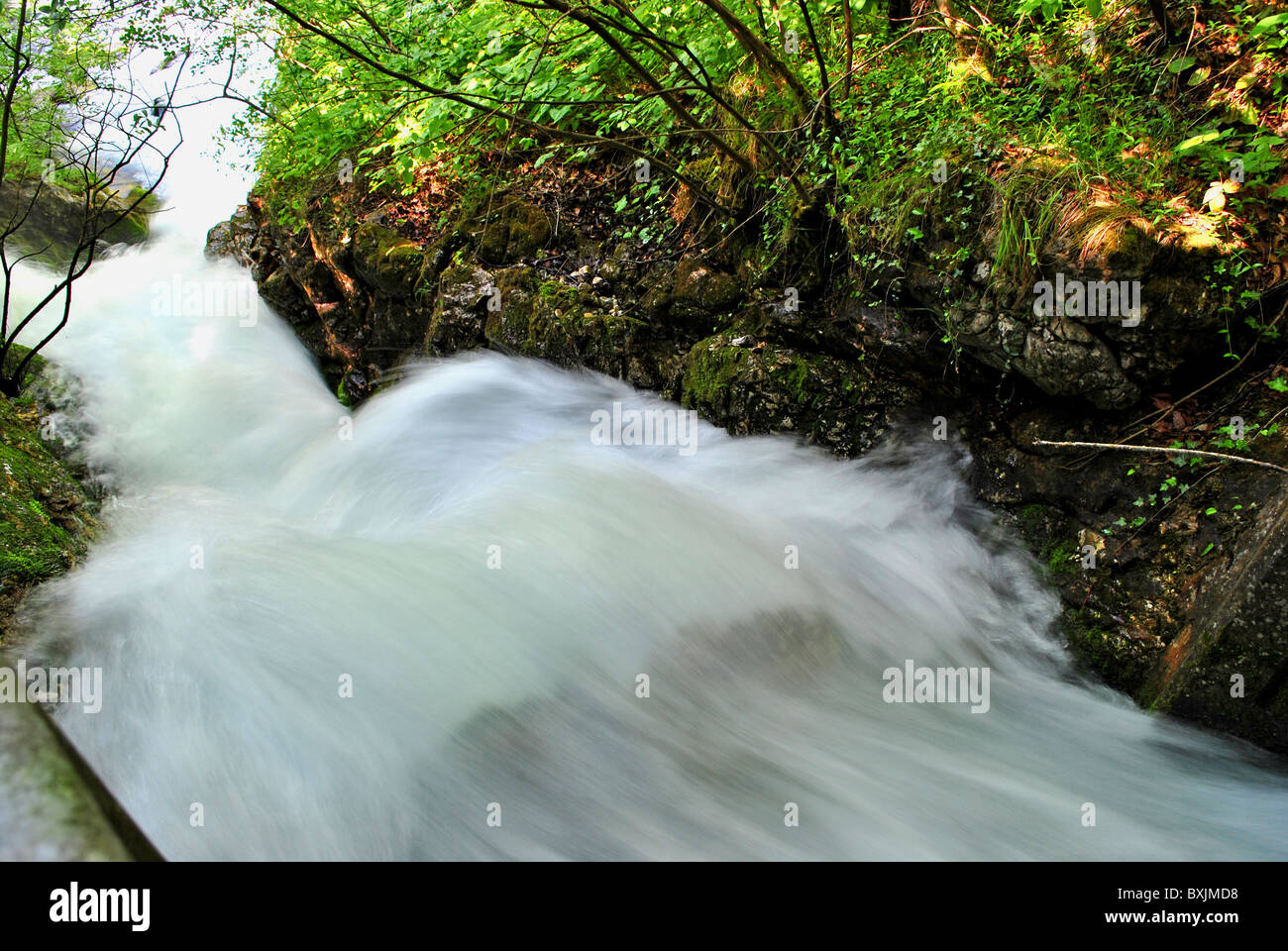land which is fresh water with a waterfall and rushing noise coming ...