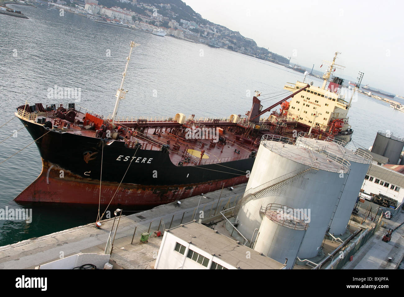 Oil tanker alongside oil jetty and tanks. Gibraltar Stock Photo - Alamy