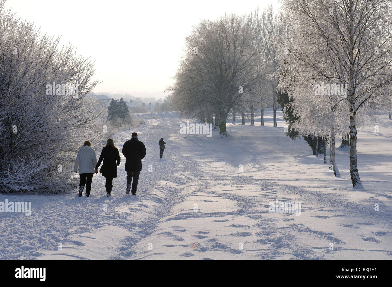 People walking in snowy conditions Stock Photo - Alamy