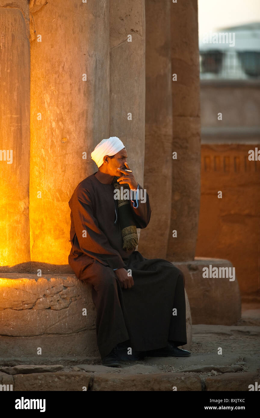 Egypt, Luxor. Arab man sitting in Luxor Temple Stock Photo - Alamy