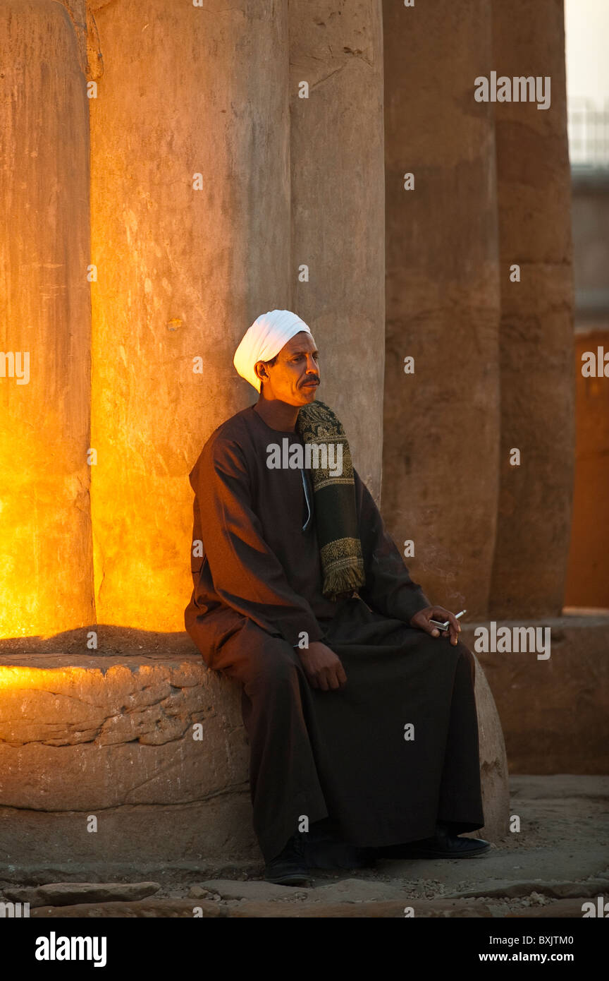 Egypt, Luxor. Arab man sitting in Luxor Temple Stock Photo - Alamy