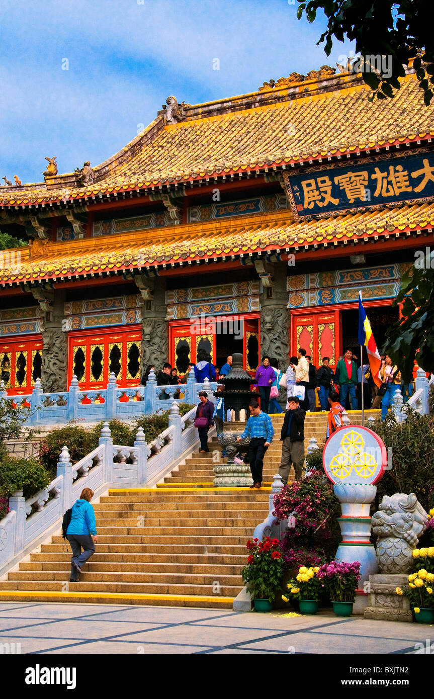 Tourist walking up stairs in Interior courtyard of Po Lin monastery at ...