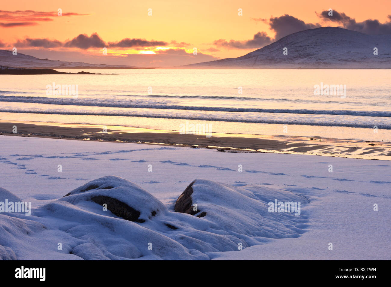 snow covered beach at sunset on the isle of Harris, Scotland Stock ...
