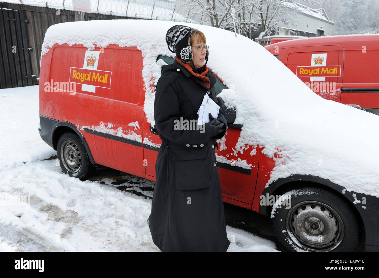Woman collecting post from the sorting office in Telford where postal ...