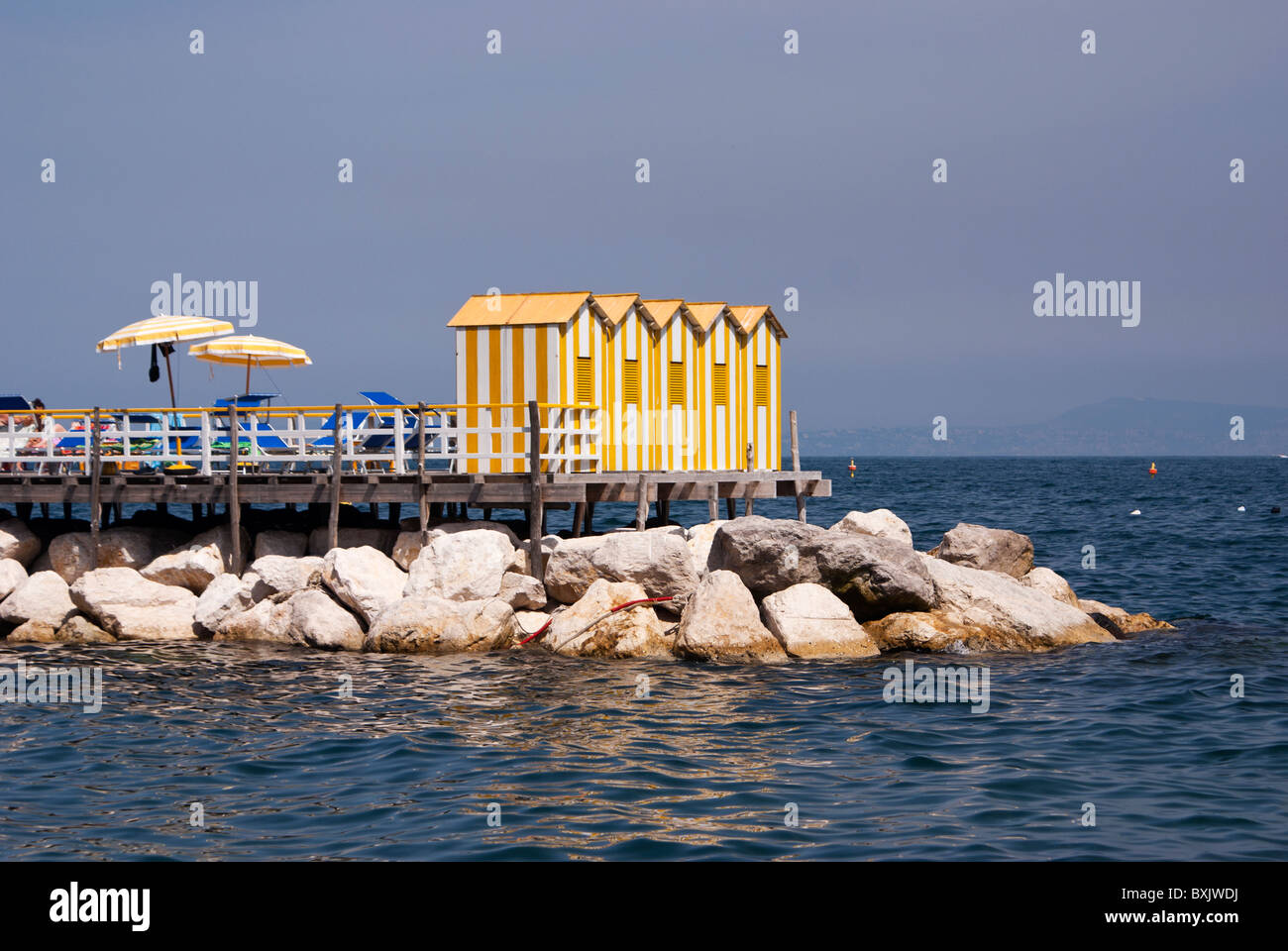 Beach huts brightly coloured on man made jetty,sorrento,italy Stock ...