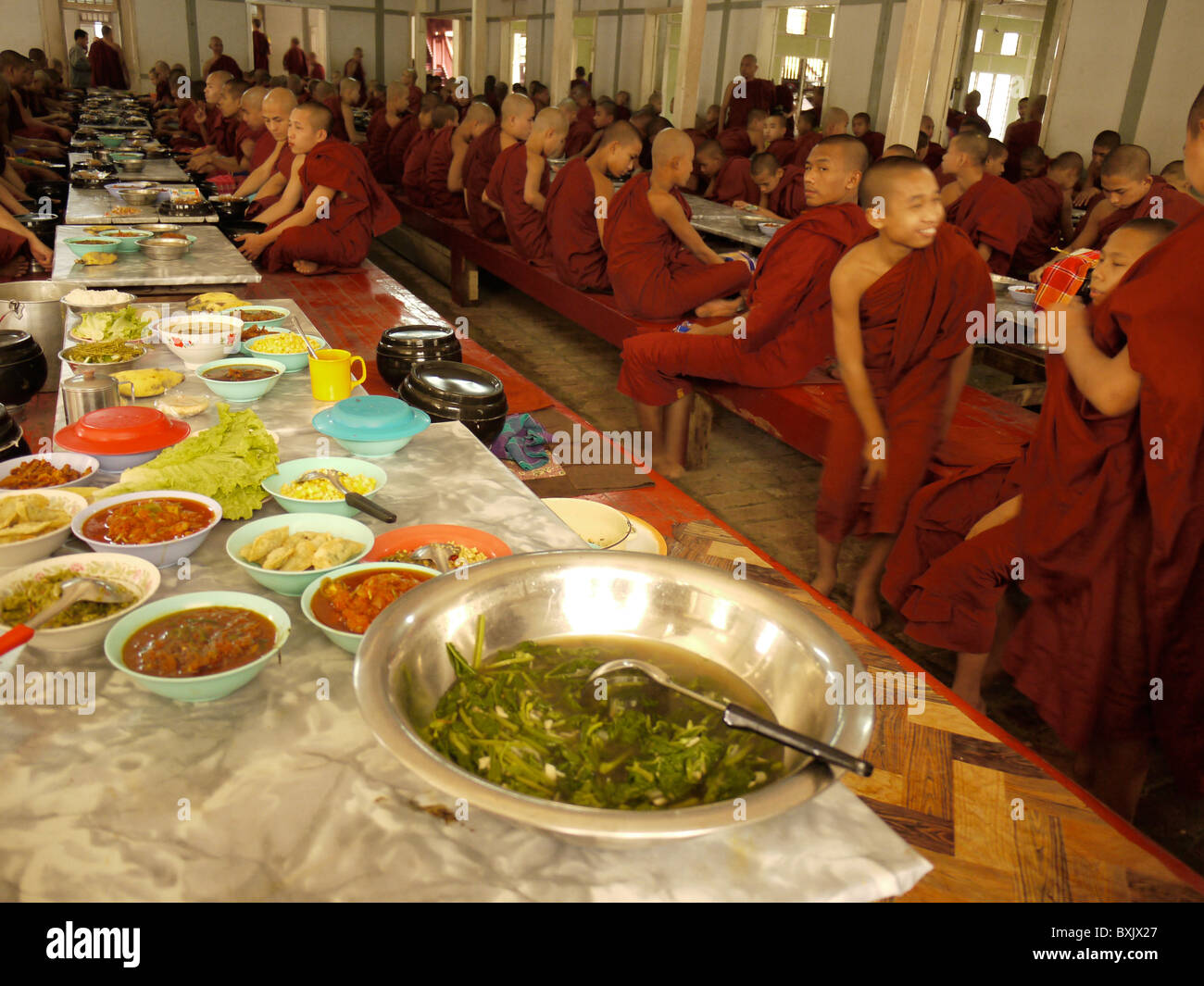 Monks sitting down for lunch at Amarapura Monastry, near Mandalay Stock ...