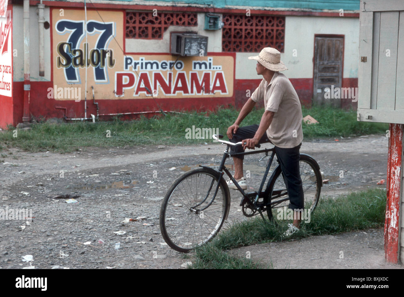 PANAMA MAN ON BICYCLE BY STREET SIGN Stock Photo - Alamy
