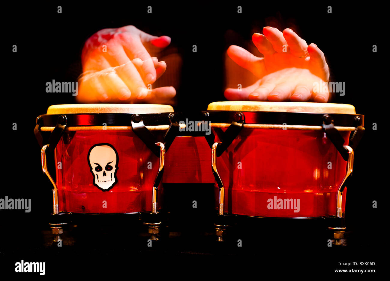 Hands playing bongo drums Stock Photo - Alamy