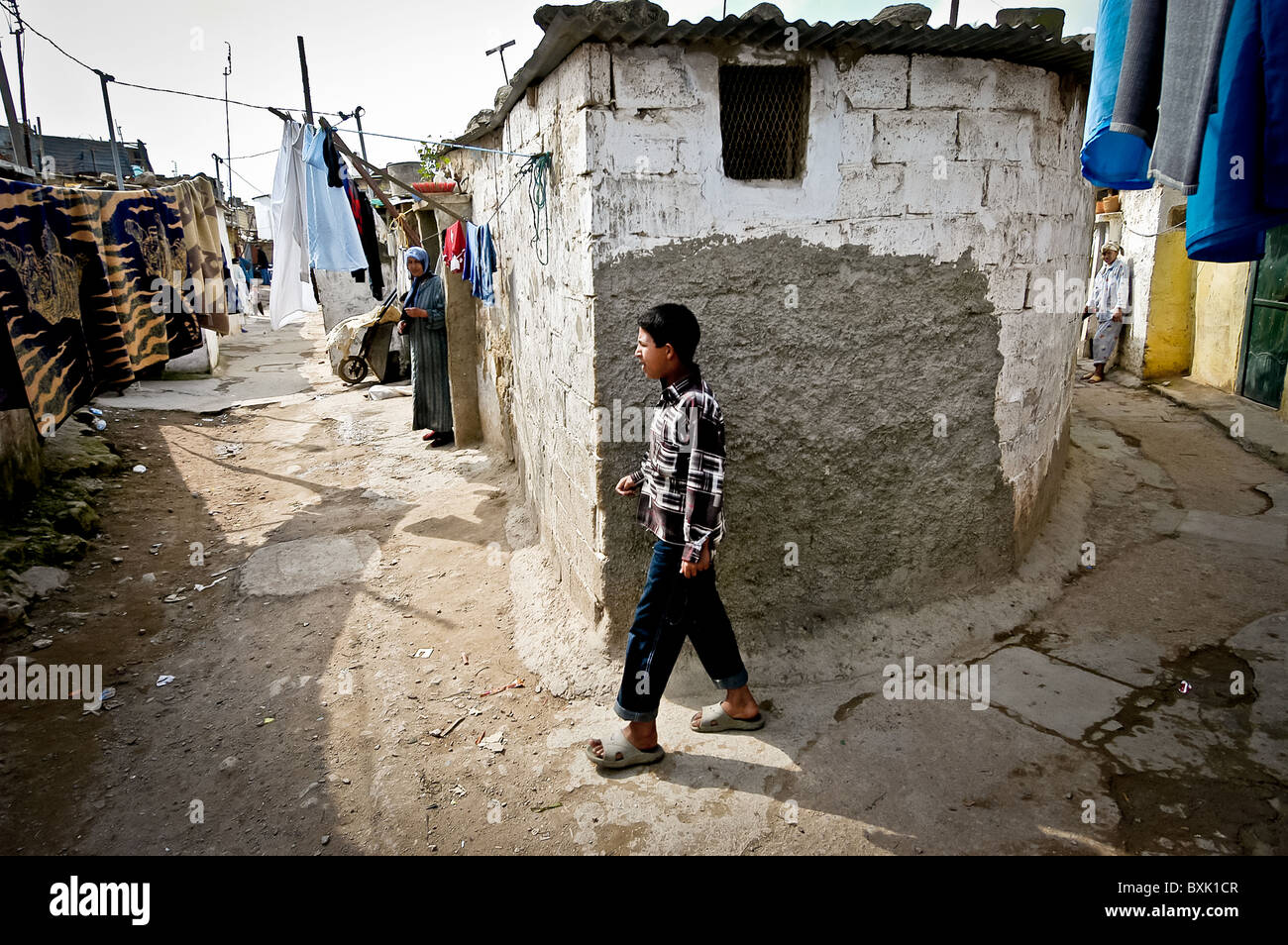 Boy walking in Douar Secouila slum Casablanca, Morocco Stock Photo - Alamy