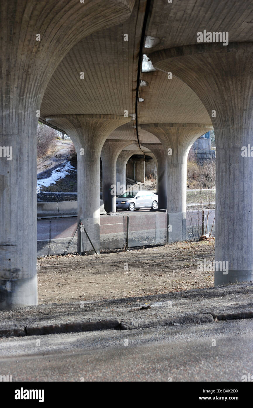 Car on a road seen from under a subway bridge Stock Photo - Alamy