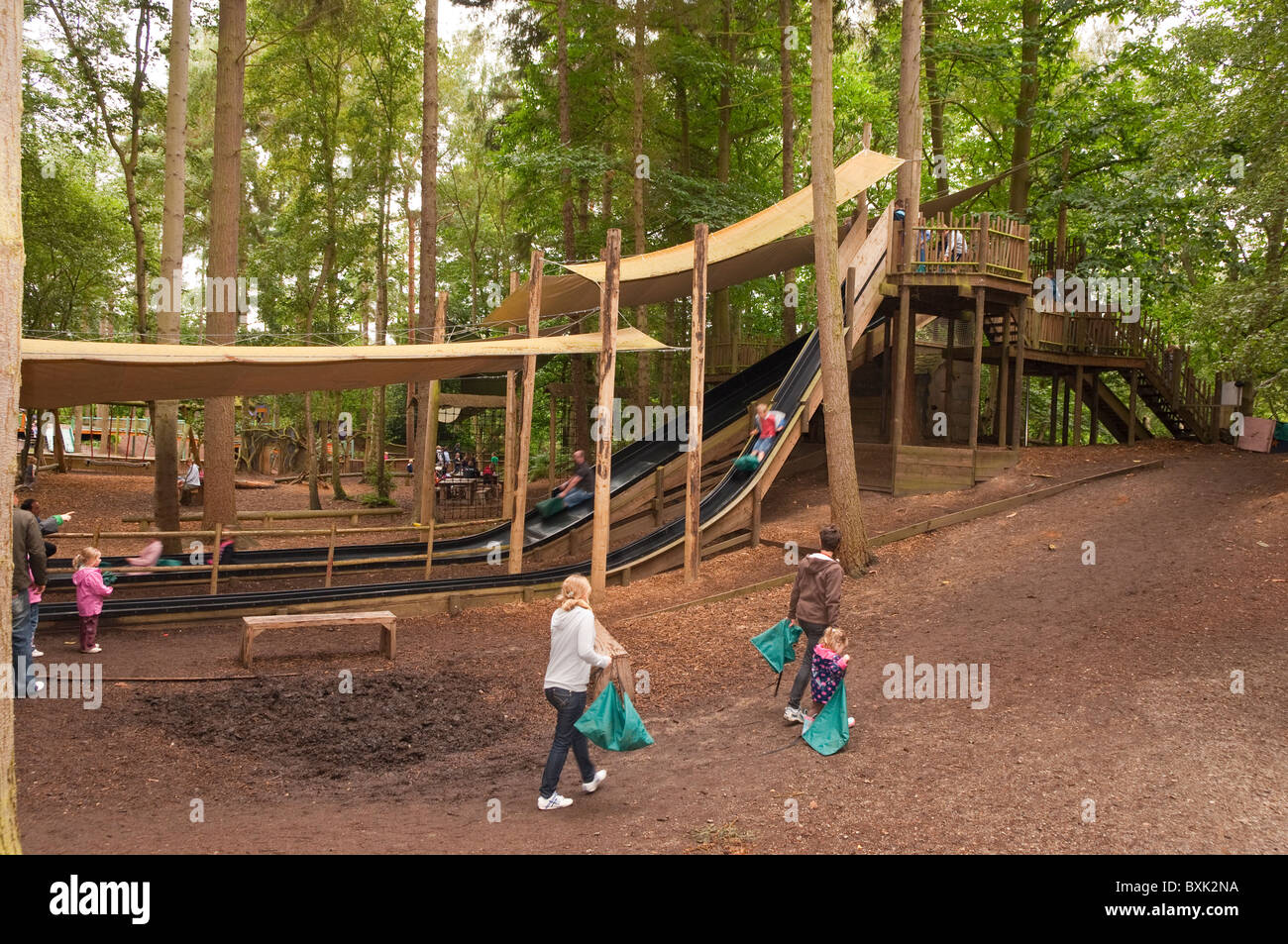 Visitors at Bewilderwood adventure park in Hoveton , Norfolk , England ...