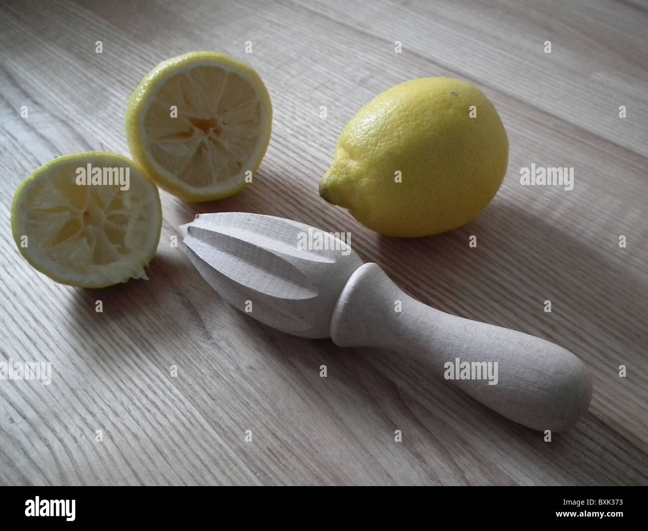 Lemons and reamer Stock Photo - Alamy