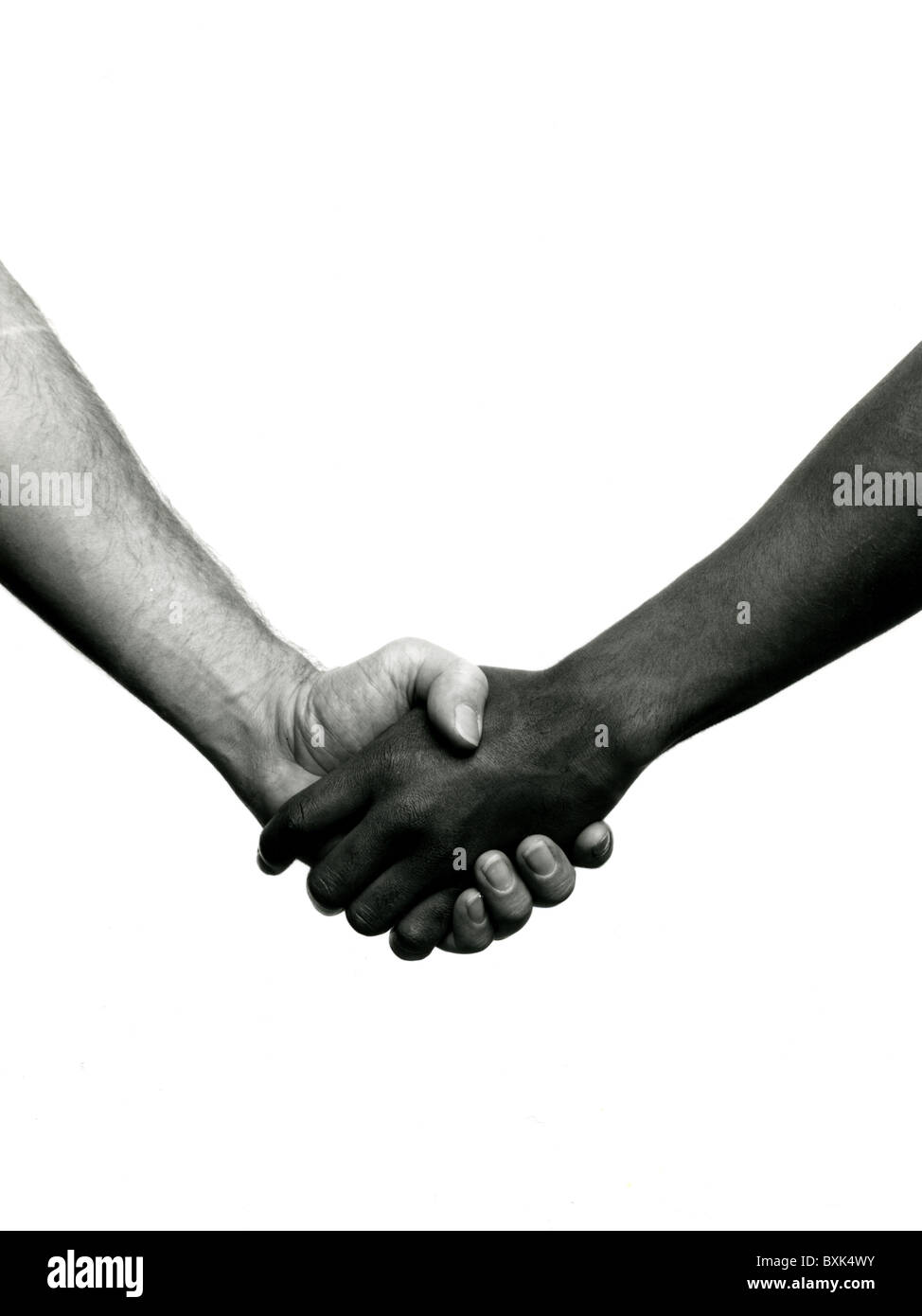 b&w picture of two men shaking, hands only; one man black and one man ...